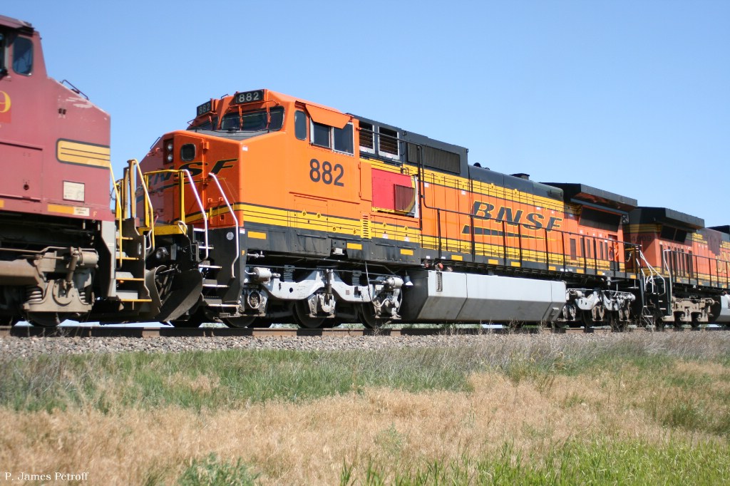 BNSF 882 (C40-8W) with new paint scheme offset by the Warbonnet box